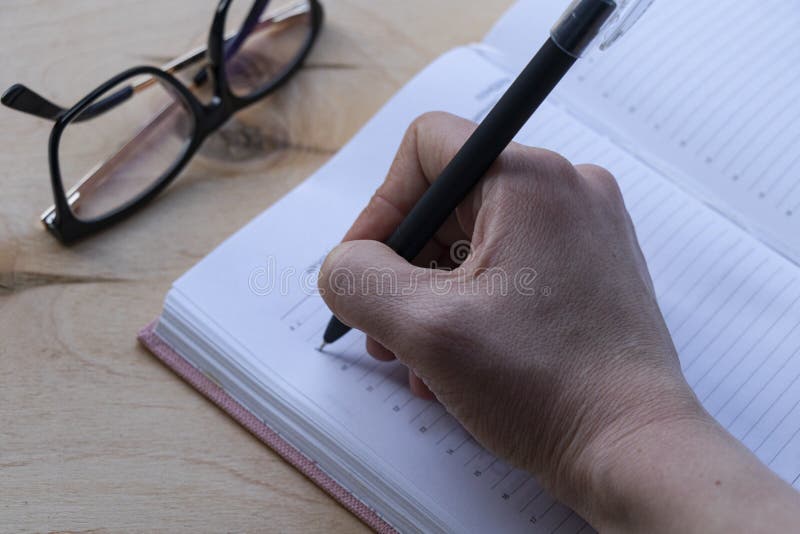 Wooden Desktop with Keyboard, Diary and Pen, Glasses for the Computer ...