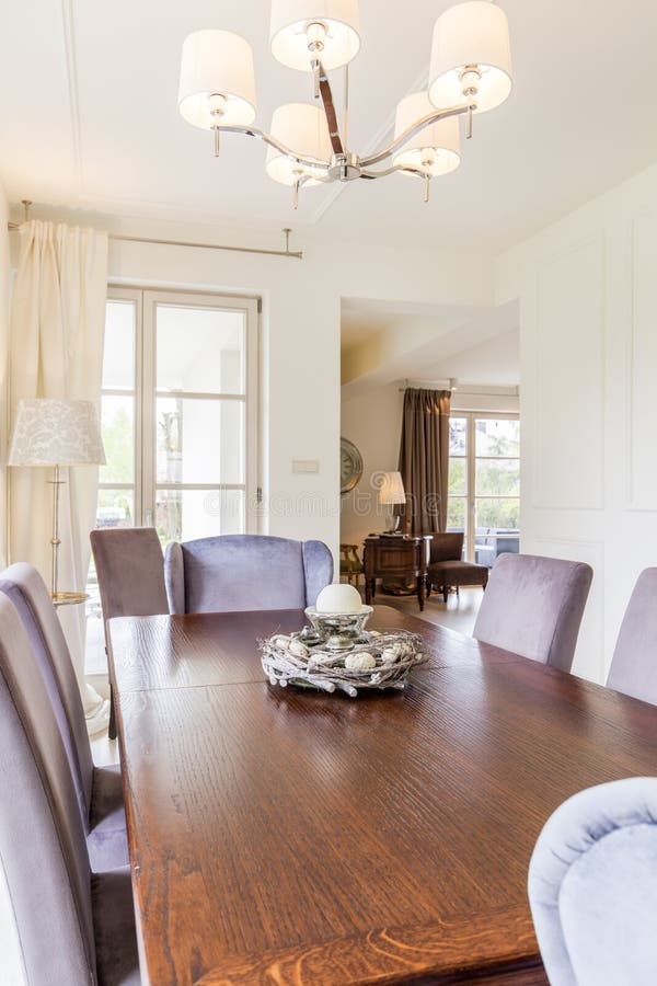 Wooden Dining Table with Comfy Chairs Stock Photo - Image of lighting ...