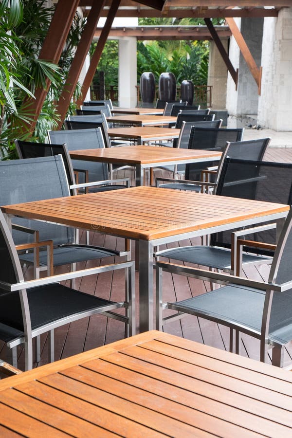 Wooden dining tables stock image. Image of green, estate - 45481143