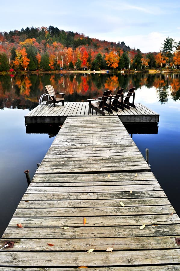Wooden dock on autumn lake stock image. Image of forest - 10262771
