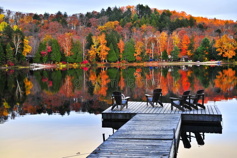 Wooden dock on autumn lake stock image. Image of forest - 10262771