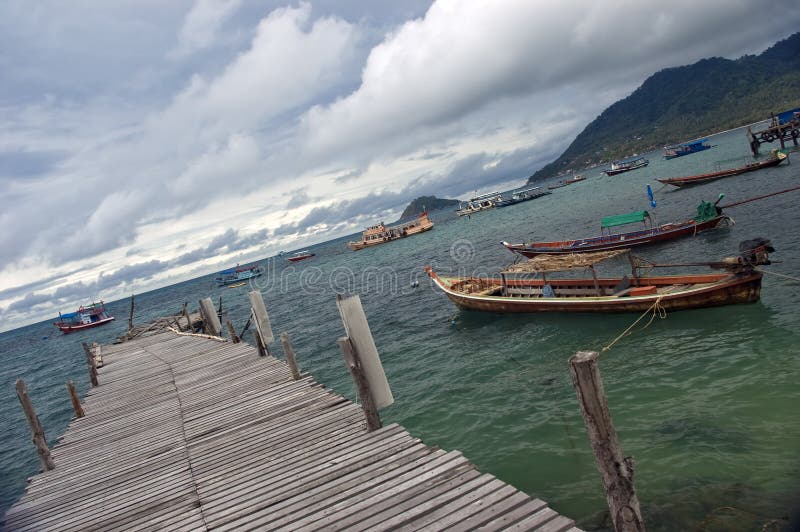 Wooden dock and boats stock image. Image of boat, wharf - 5486851