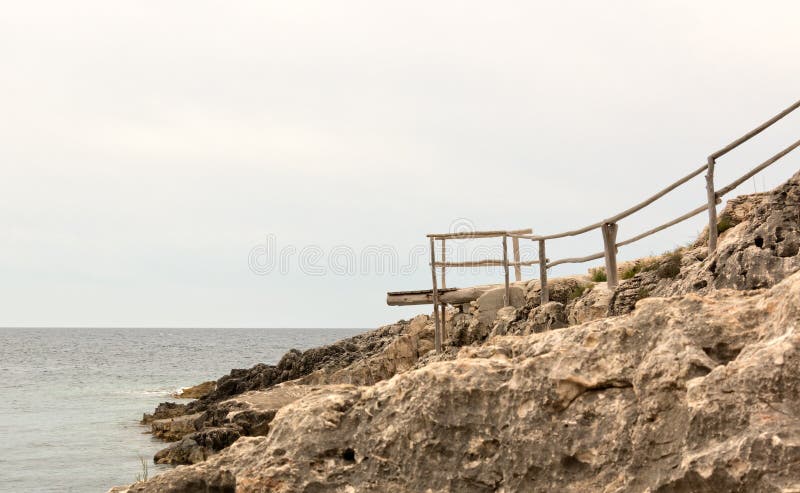 Wooden dock at the cliff stock photo. Image of banister - 42102946