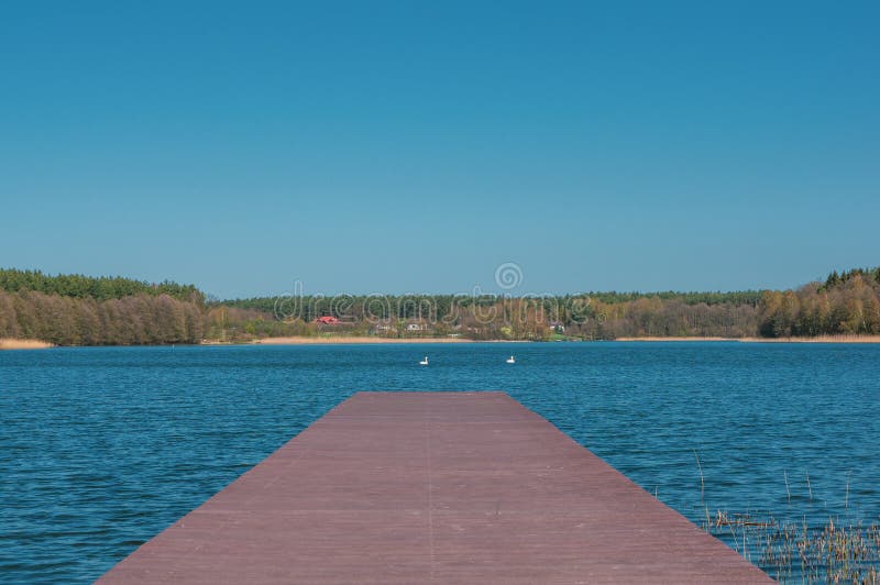 Wooden Dock Over the Sea Under a Clear Blue Sky Stock Photo - Image of ...