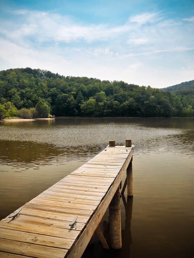 Wooden Dock Overlooking Peaceful Mountain Lake Stock Photo - Image of ...