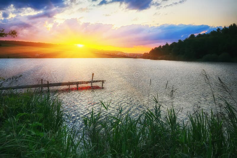 Wooden Dock, Pier, on a Lake in the Evening Stock Photo - Image of ...