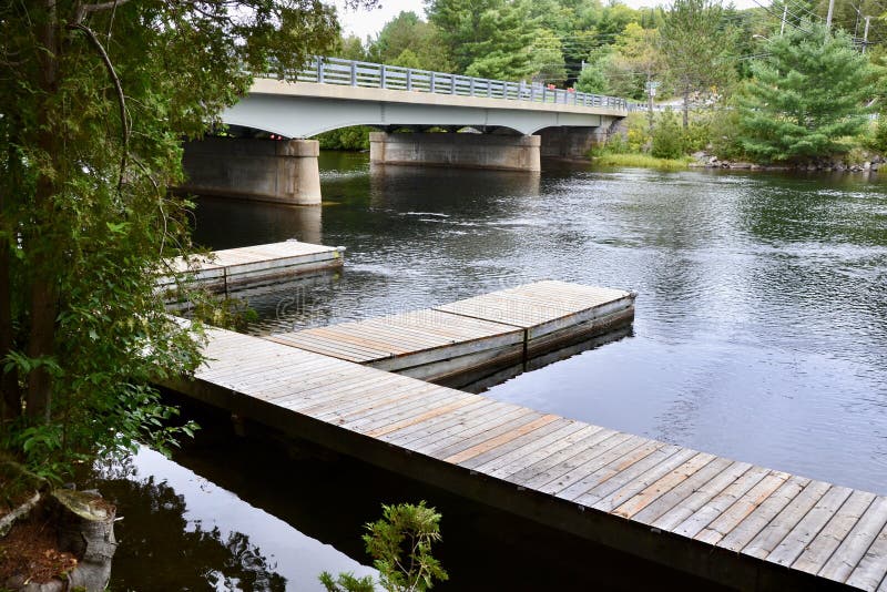 Wooden Docks and Bridge Along Baysville Riverfront Stock Photo - Image ...