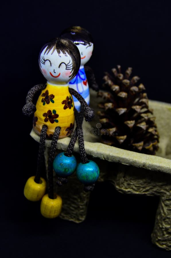 WOODEN DOLL with ROPE ARMS & LEGS on BLACK BACKGROUND Stock Photo ...