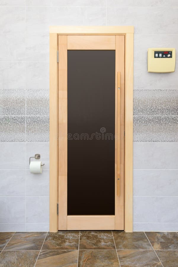 Wooden Door with Glass on the Wall Made of Ceramic Tiles Stock Image ...