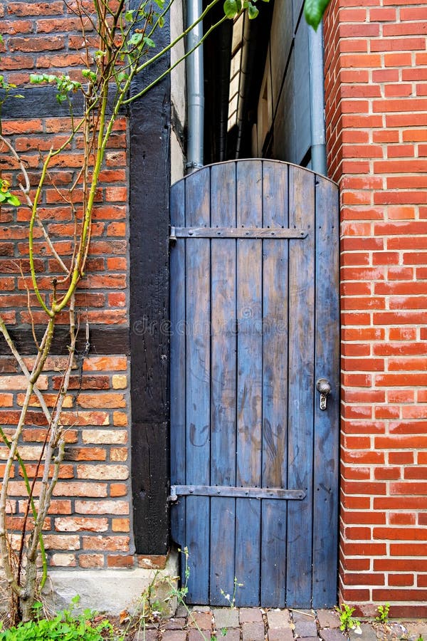 Wooden Door is Open in Brick Building Stock Photo - Image of germany ...
