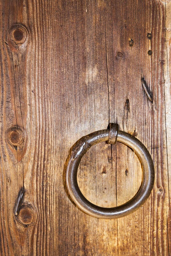 A wooden door with a ring. stock image. Image of interior - 90658193
