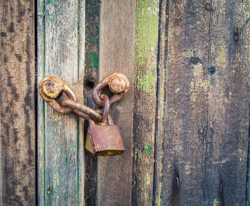 Rusty Chain and Lock on a Door Stock Photo - Image of wood, steel ...