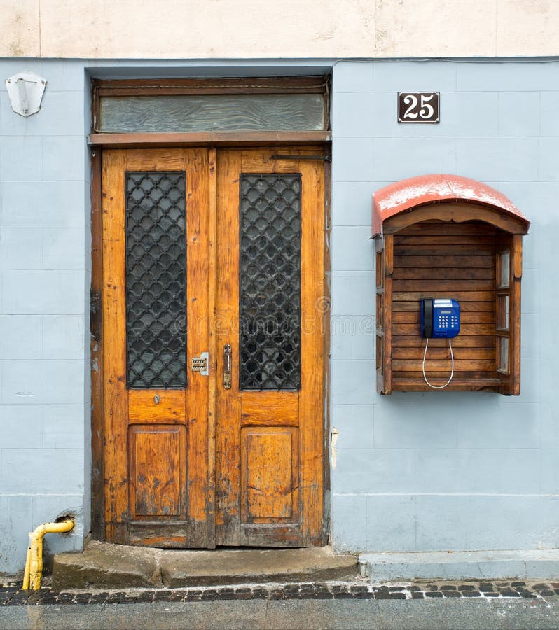 Wooden door and telephone stock photo. Image of antique - 29472622