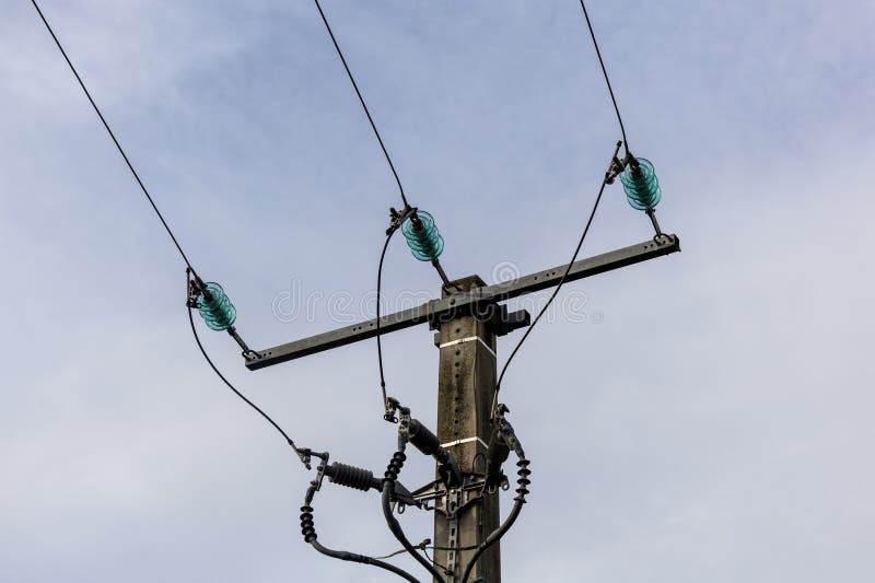 A Wooden Electricity Pole with Green Insulators Stock Image - Image of ...