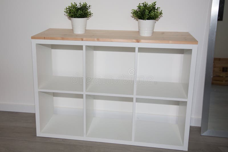 Wooden Empty Shelves with Small Beautiful Plants on Light White Wall ...