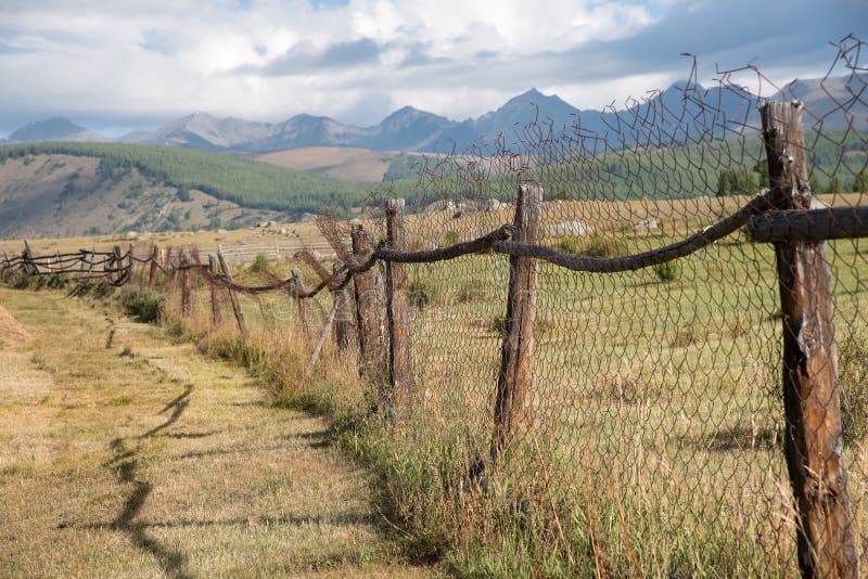 Wooden Fence in the Highlands and Sky with Clouds Stock Image - Image ...