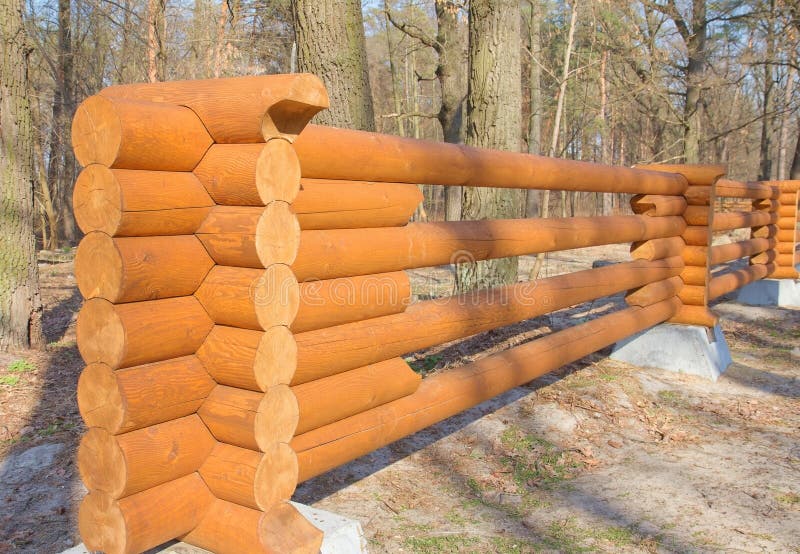 Wooden fence made of logs stock photo. Image of color - 24285018