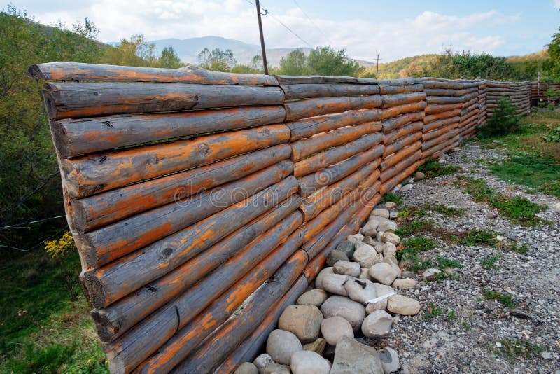 Wooden fence made of logs stock photo. Image of autumn - 162768508