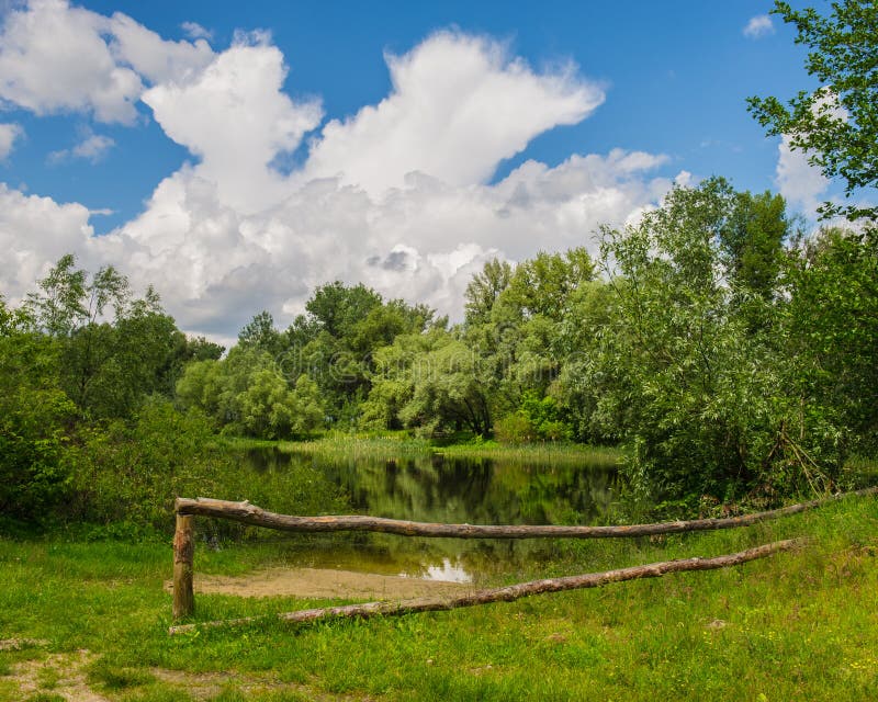 Green Grass River Landscape Wood Fence Nature Rural Scene Stock Image