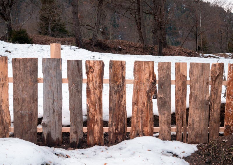 Wooden fence with snow stock image. Image of concept - 140896009