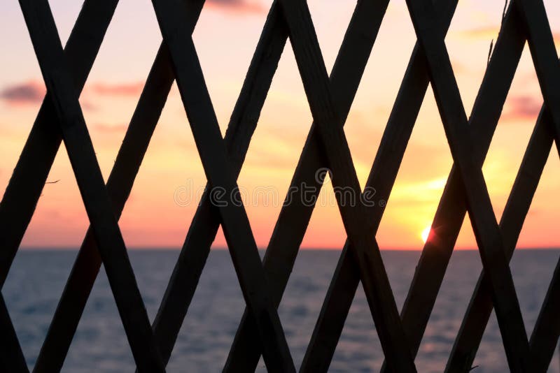 Wooden Fence with Sunset View Stock Photo - Image of vacation, water ...