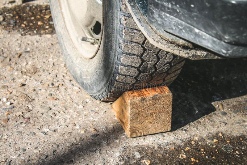 Wooden Fence Under the Wheel for the Machine. Wheel Stop. Stock Photo ...
