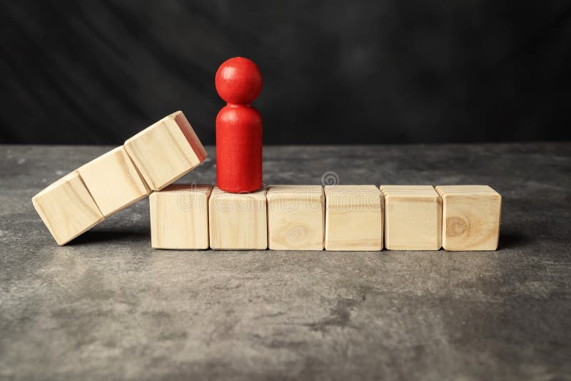 A Wooden Figure and a Row of Wooden Cubes Stock Photo - Image of brick ...