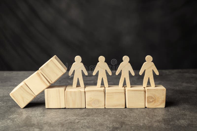 A Wooden Figure and a Row of Wooden Cubes Stock Image - Image of object ...