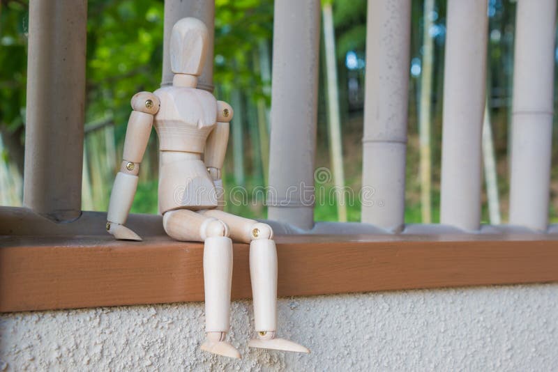 Wooden Figure Sitting on Architrave Window Stock Image - Image of ...