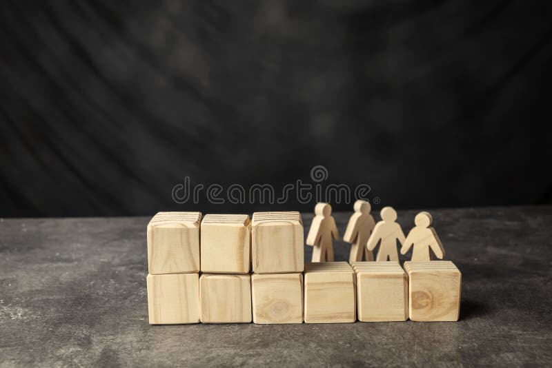 A Wooden Figure and a Stack of Wooden Cubes Stock Image - Image of ...