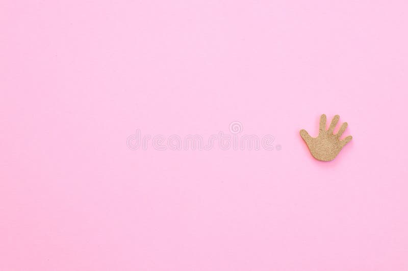 Wooden Figures in the Form Hand on a Pink Background Stock Image ...