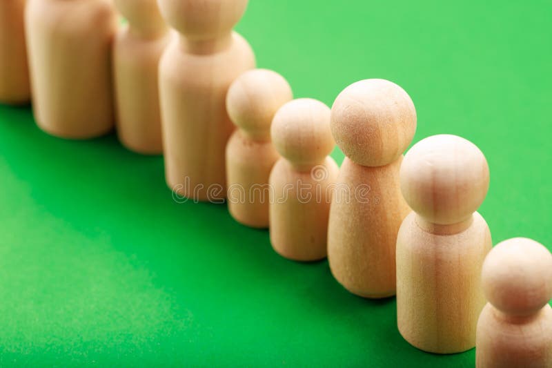 Wooden Figures on Green Surface: Abstract Conceptual Arrangement Stock ...