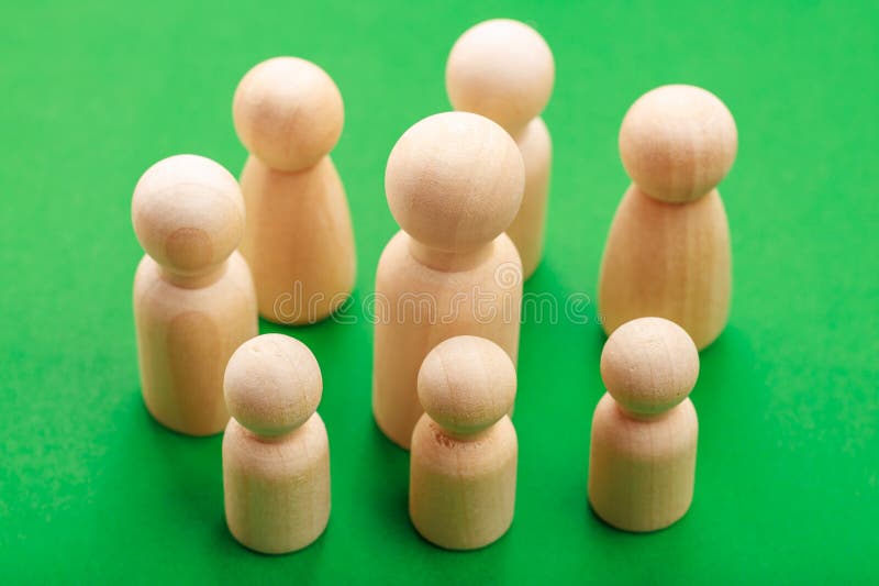 Wooden Figures Group on Green Background Symbolizing Diversity and ...
