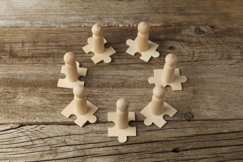 Wooden Figures on Puzzles. People Analytics and Optimization, Team ...