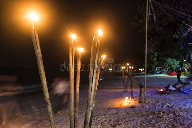 Torches at the beach stock image. Image of ocean, beauty - 14173307