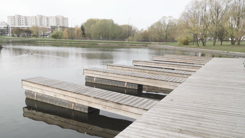 A Floating Jetty for Mooring Ships is Fixed with Metal Rods on Hinges ...