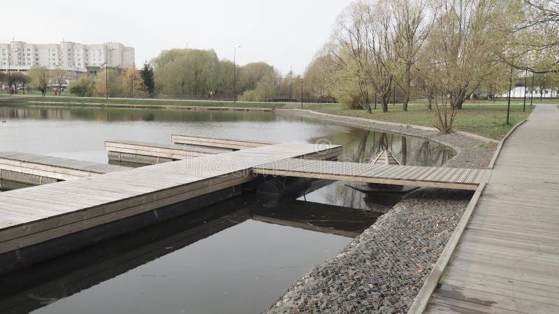 A Floating Jetty for Mooring Ships is Fixed with Metal Rods on Hinges ...