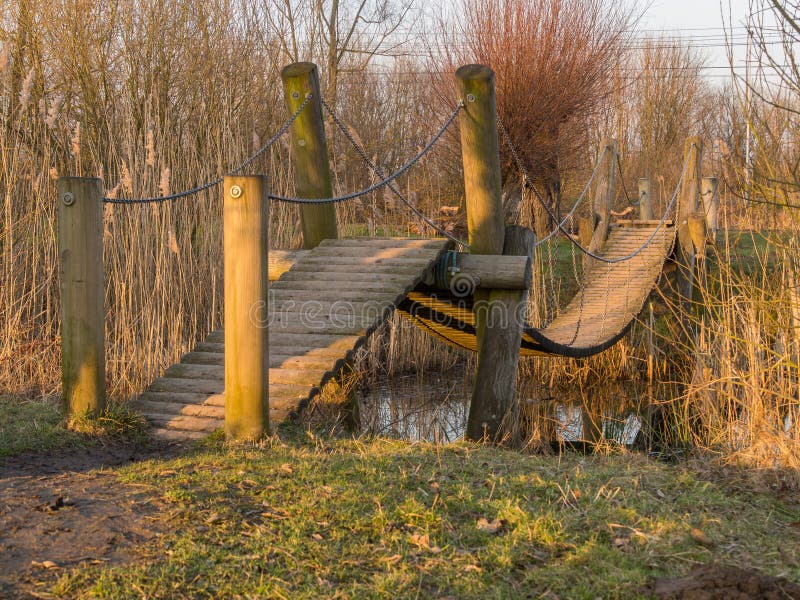 Wooden Footbridge Over Stream by Sunset Stock Image - Image of ...