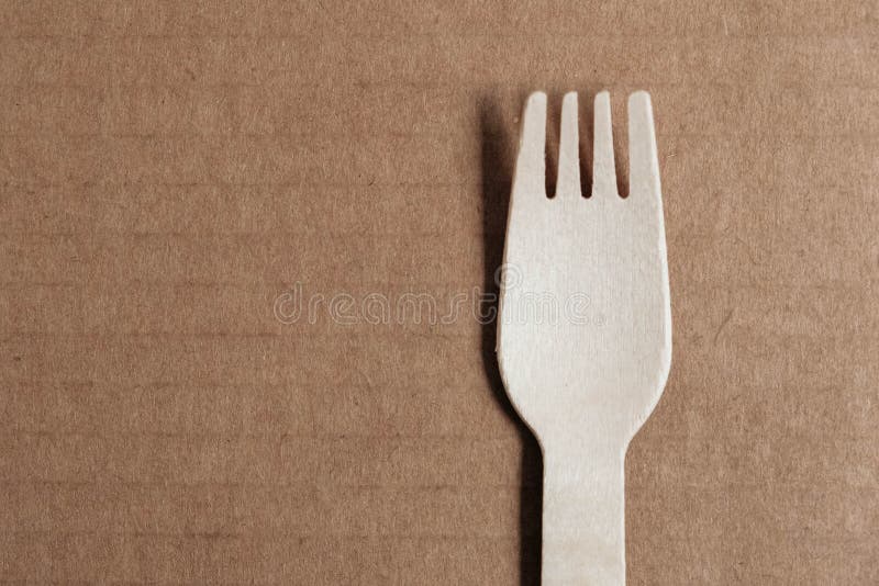 Wooden Fork on a Cardboard Background. Eco Friendly Disposable ...