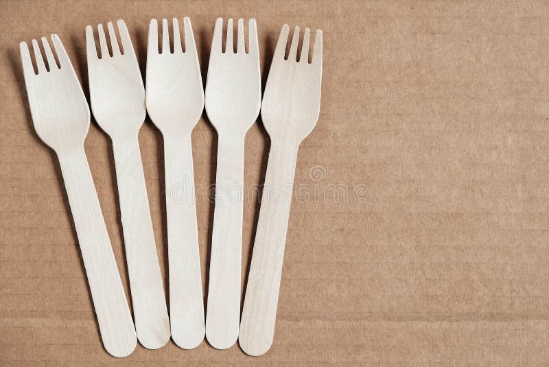 Wooden Forks on a Cardboard Background. Eco Friendly Disposable ...