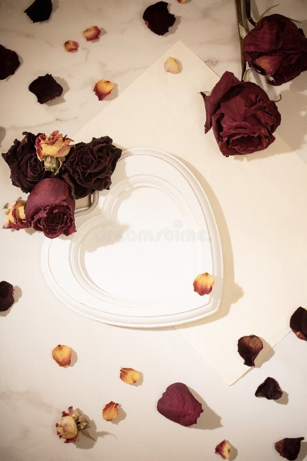 Wooden Frame with Dried Red Roses on Marble Background Stock Photo ...
