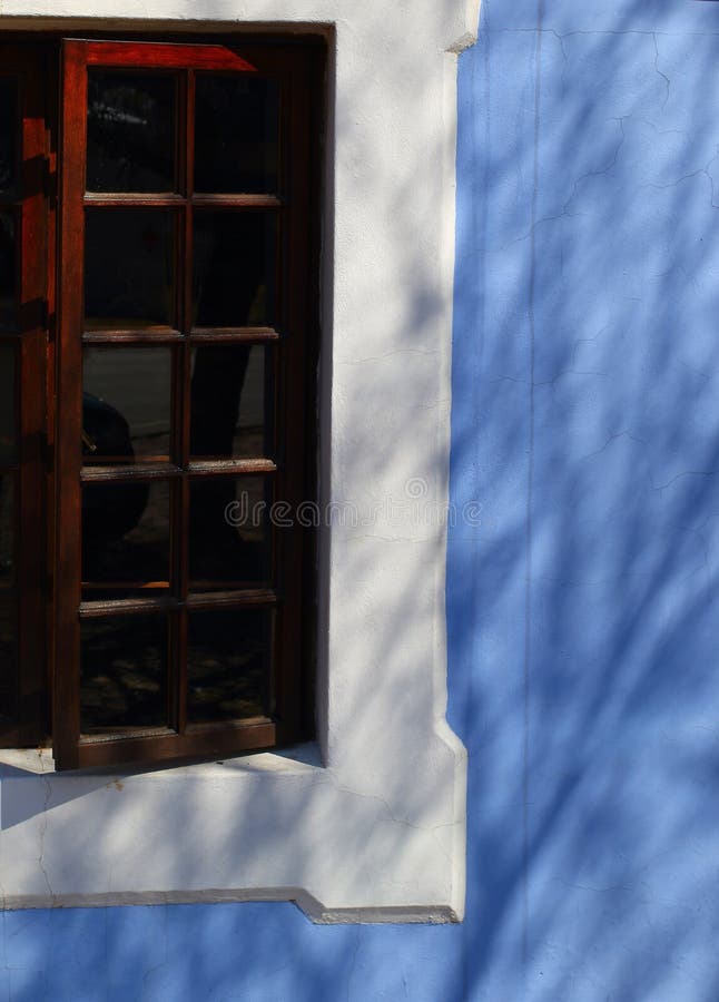 Wooden Framed Window in Blue and White Painted Wall Stock Photo - Image ...