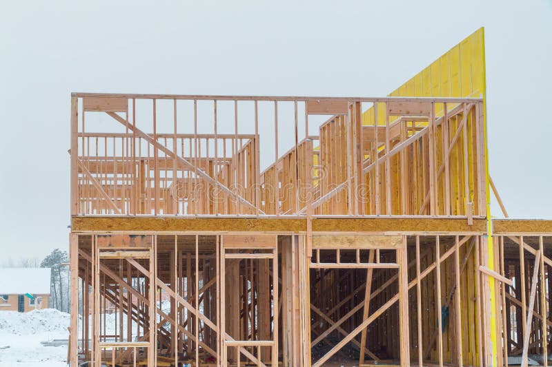 An Wooden Framing of New Construction Home with Beams Attached To a ...