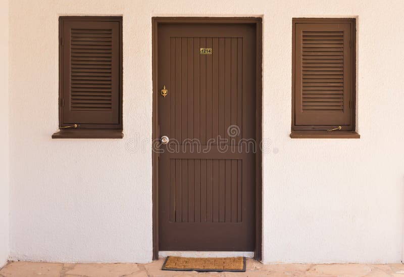 Wooden Front Door of a Home Stock Photo - Image of yellow, doormat ...