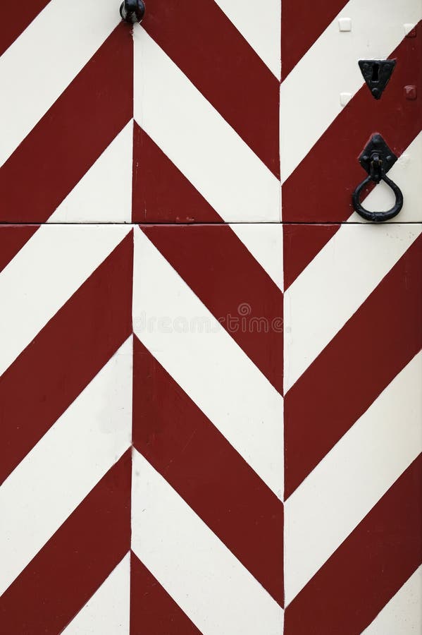Wooden Gate at a Castle with Red and White Pattern Going Up and Down ...