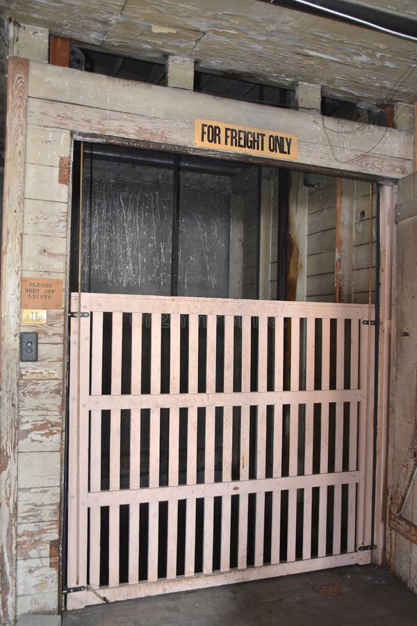 The Wooden Gate is Closed To a Very Old Freight Elevator in an Old ...