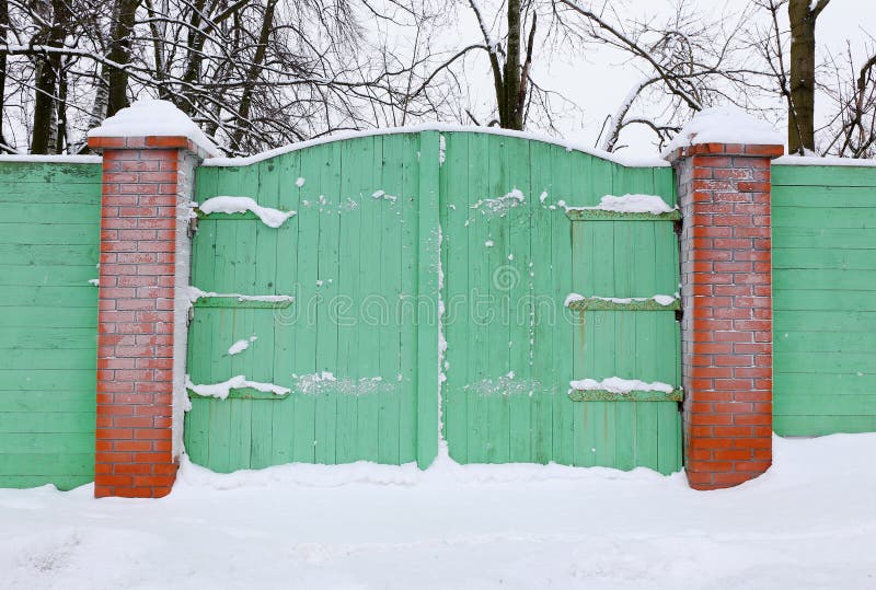 Wooden Gate Covered with Snow Stock Photo - Image of green, rural: 65765874
