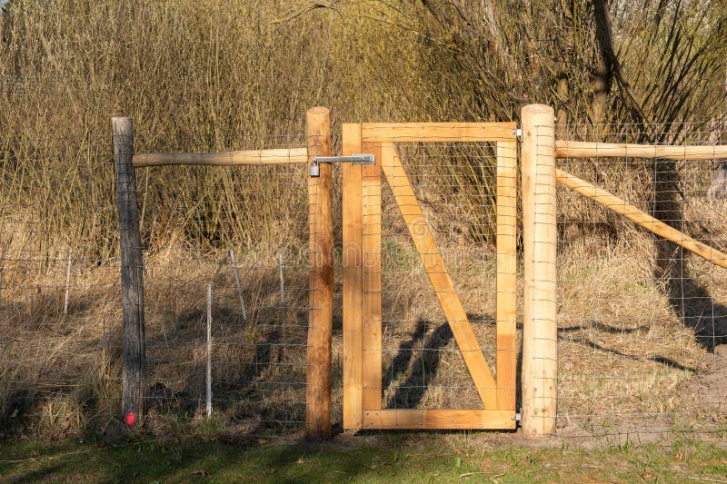 A Wooden Gate with a Metal Latch and a Wooden Handle Stock Image ...