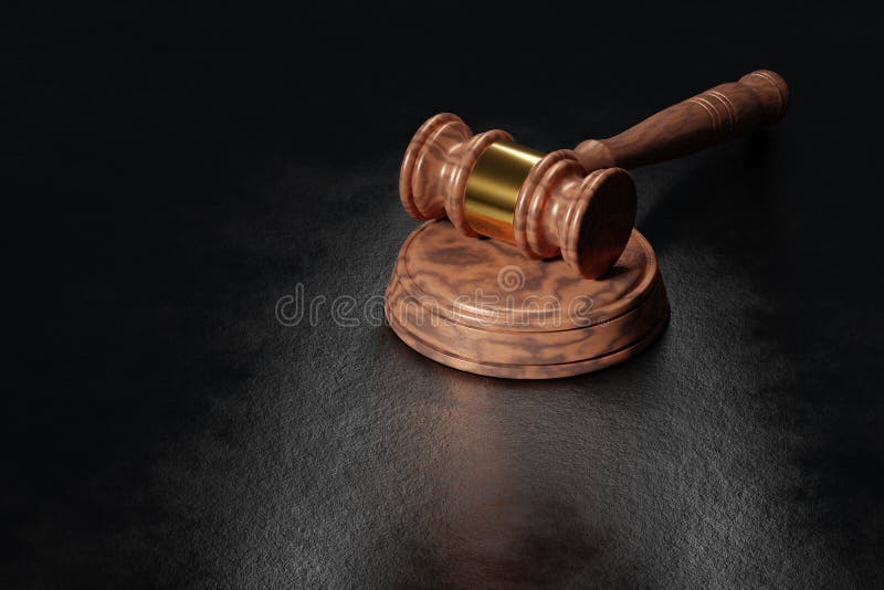 A Wooden Gavel with a Gold Clip for an Auction on a Stand on a Wooden ...
