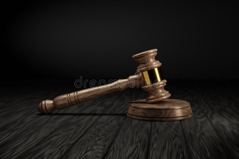 A Wooden Gavel with a Gold Clip for an Auction on a Stand on a Wooden ...